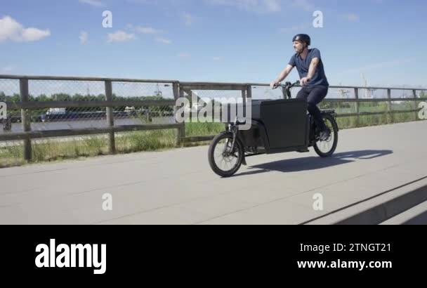 Cargo bicycle cycles Stock Videos & Footage - HD and 4K Video Clips - Alamy