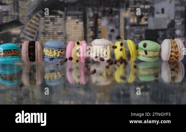 scatter coffee beans on glass table in front of a french dessert macarons fragrant breakfast ...