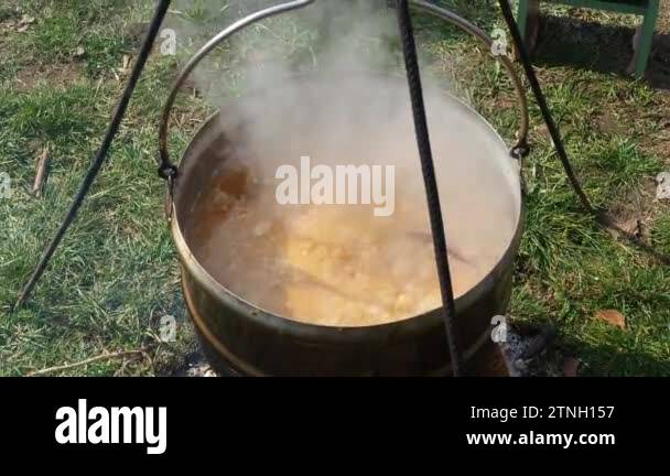 Cooking a traditional Serbian Balkan dish sauerkraut with smoked pork ...