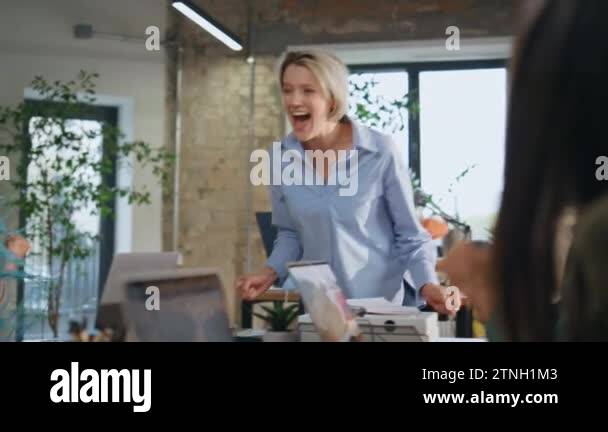 Overjoyed boss celebrating achievement team with office colleagues ...