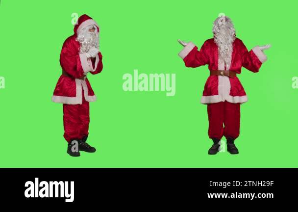 Santa claus praying to god with hands in a prayer, posing over full ...