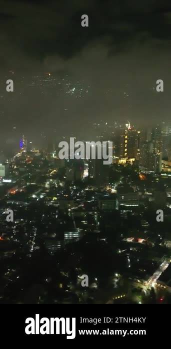 Illuminated flight above the stunning city of Cebu. Downtown city at ...