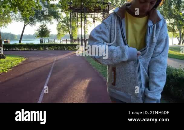 Multiracial young woman readies for refreshing morning jog in ...