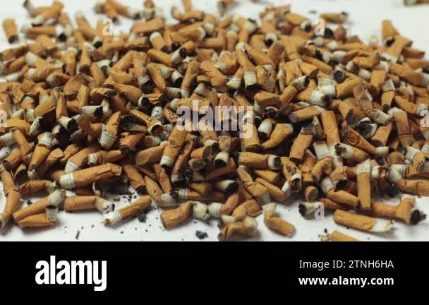 Many smoked cigarettes. Environmental pollution. Smoking harms health ...