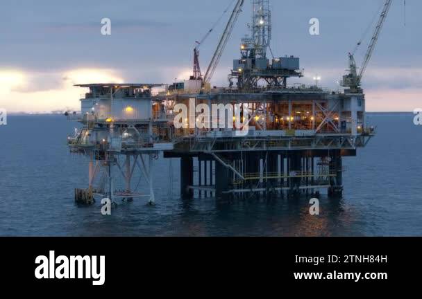 Offshore oil drilling rig and lots of ships on the horizon in the ...