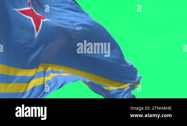 Flag of Aruba waving in the wind on a green screen. Light blue field, 2 yellow stripes, 4 ...