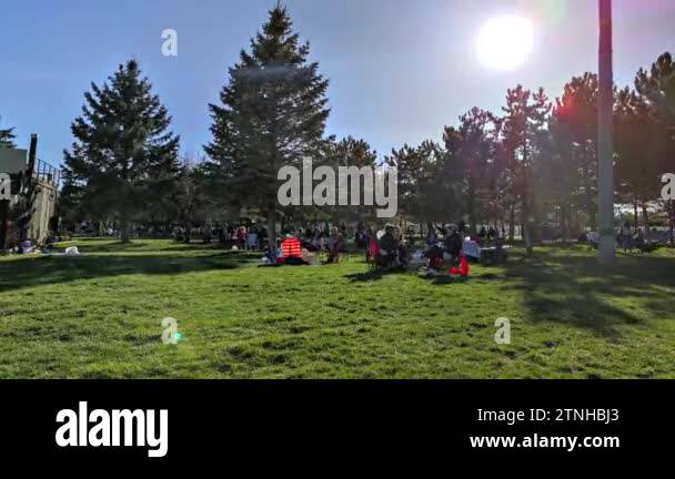 Time lapse video of the public park.Happy people sunbathing on grass ...