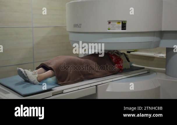 Computerized Axial Tomography (CAT). MRI machine and screens with ...