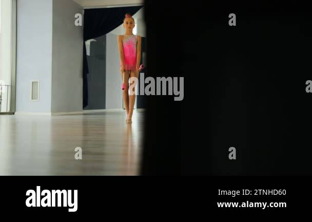 Young blonde hair girl doing exercive with mace in the hand in the ...