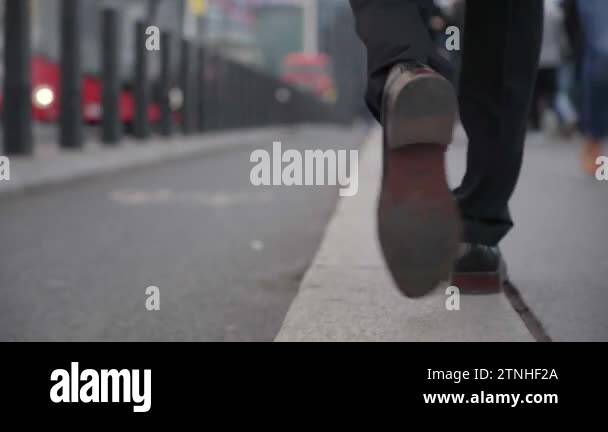 Rear back view feet of Business man commuting to work. Rear back view ...