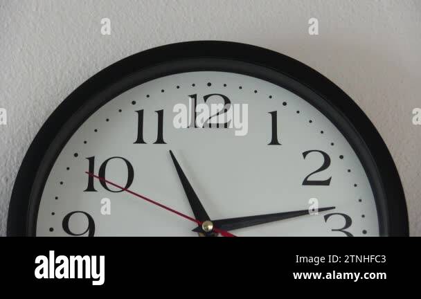 Red Second Hand Moving Across Analog Clock Face From 9 To 3 With White ...