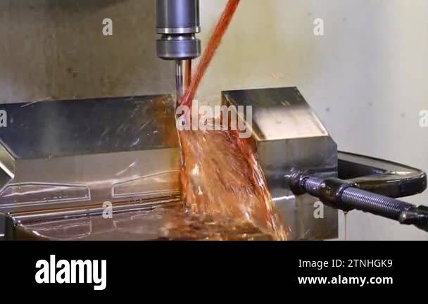 Pan scene the CNC milling machine cutting the tire mold parts with oil ...