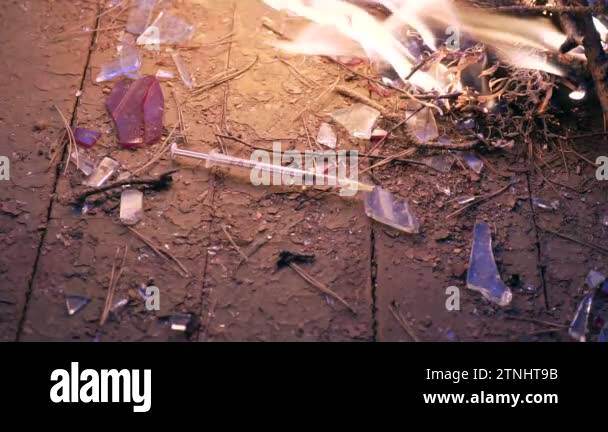 syringe falling down spraying blood after a heroin cocaine injection on ...