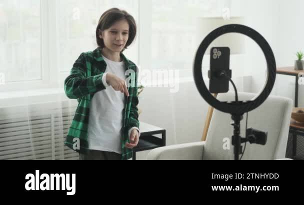 A talented Caucasian school-aged boy, passionate about vlogging ...
