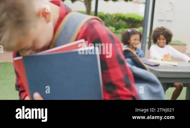 Video of sad caucasian schoolboy being taunted by two diverse children ...