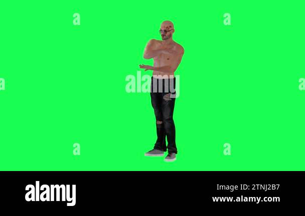 Criminal man and drug addict gangster with athletic body in green ...