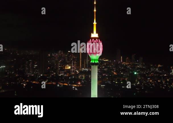 Orbit shot around top of tall TV tower in lotus flower design. Colombo ...