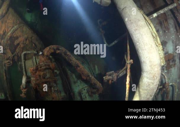 Scuba divers swims on the Shipwreck Swedish ferry MS Zenobia. Wreck diving. Mediterranean sea ...