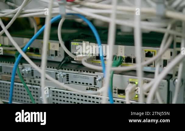 close-up of a pile of network patch cables in a server room in a data ...