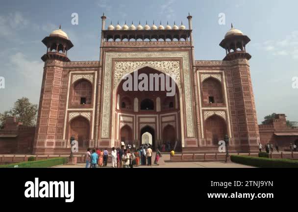exterior shot of the main entrance gate to the taj mahal at agra, india ...