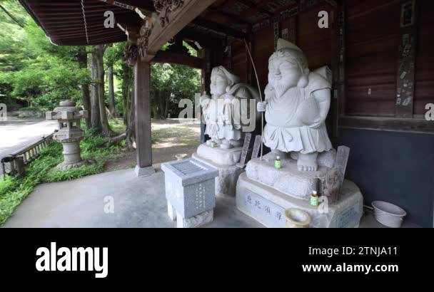 Japanese guardian statues at the traditional street in Tokyo. High ...