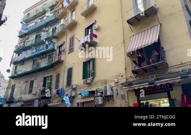 Via dei Tribunali central busy street in Napoli old town. Italian ...