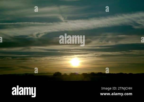 Celestial Symphony: Time-Lapse of the Setting Sun Painting the Horizon ...