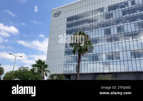 Intel logo on a glass building. Tech company headquarters in Israel ...