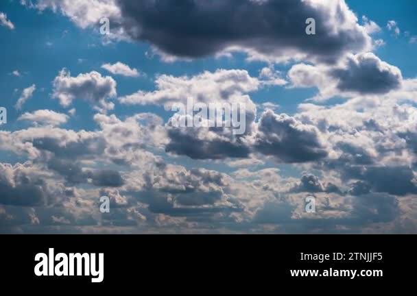 Timelapse of cumulus clouds moving in the blue sky. Cloud space ...