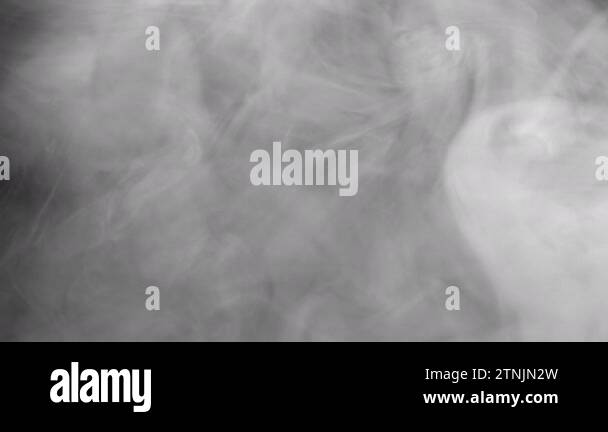 Swirling smoke filling the screen and moving past the camera. Recorded ...