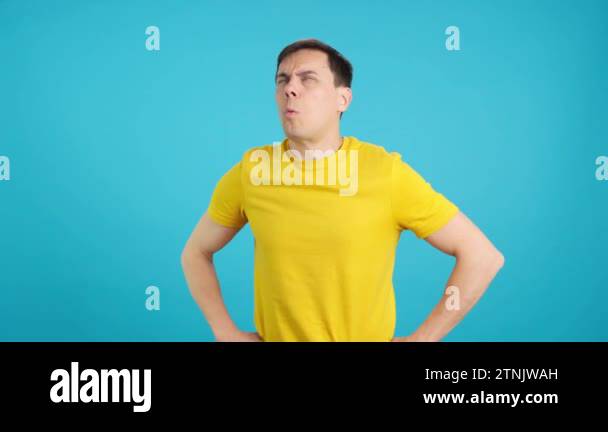 Video in studio with blue background of a foolish man thinking but cant ...