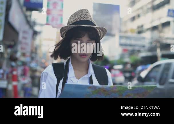 Travel concept of 4k Resolution. Asian women are using maps to find ...