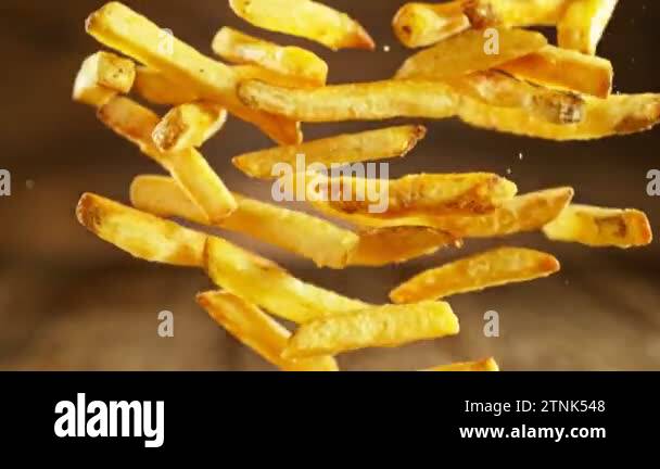 Super Slow Motion of Flying French Fries. Filmed on High Speed Cinema ...