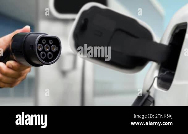 Focus EV charger pointing in front of camera display futuristic smart ...