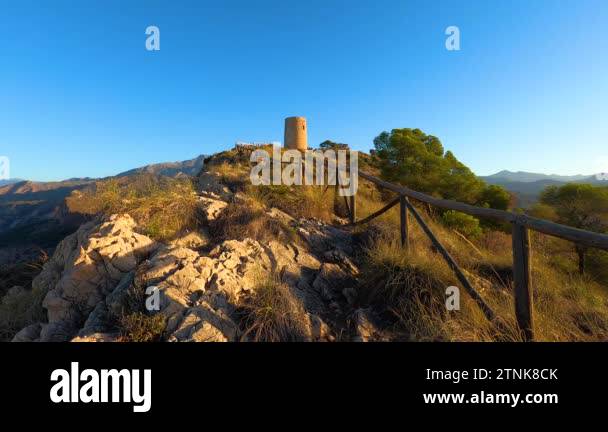 Sunrise over Mediterranean sea. Historic Torre Vigia De Cerro Gordo, a ...