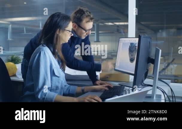 Female Industrial Technician and Male Chief Engineer Designing 3D ...