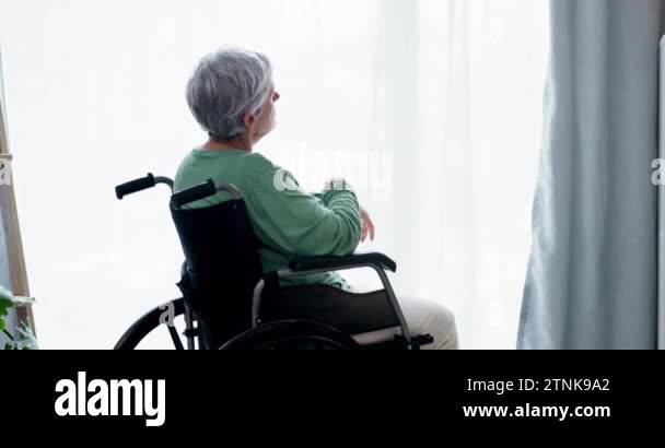 Senior, woman and thinking in wheelchair in home to relax for person with a disability in ...