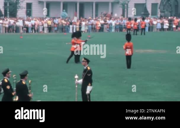 Canadian Police Ceremonial Guard in Red with Black Hat marching alone ...