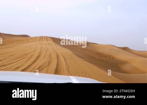 4x4 off road land vehicle taking tourists on desert dune bashing safari ...