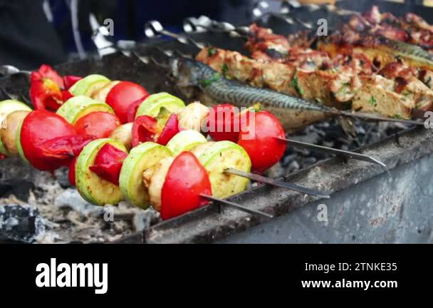 Barbecue fish, meat and vegetables roast on the grill.Street Food, Fast ...