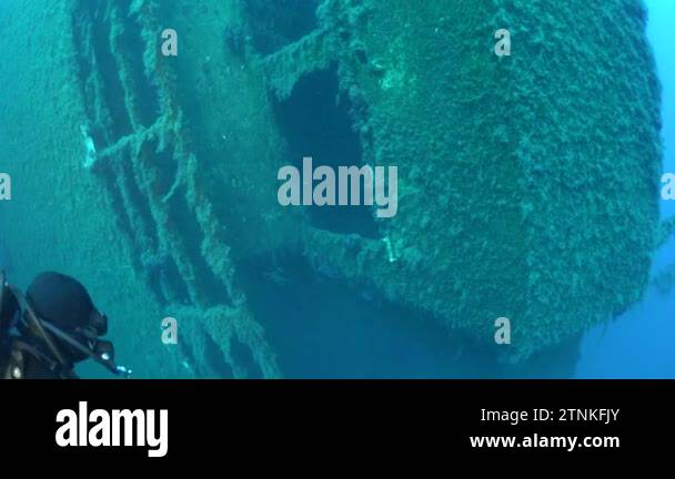 MEDITERRANEAN SEA, CYPRUS - AUGUST, 2019: Scuba divers swims on Shipwreck Swedish ferry MS ...