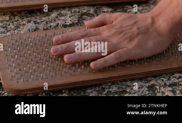 sadhu board concept close up hands of male practitioner of standing on ...