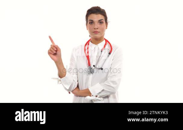 Young female doctor shaking her finger at the viewer, warning about a ...