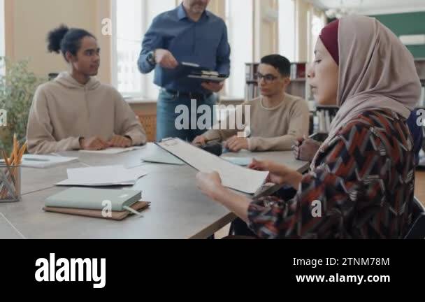 Students handing Stock Videos & Footage - HD and 4K Video Clips - Alamy