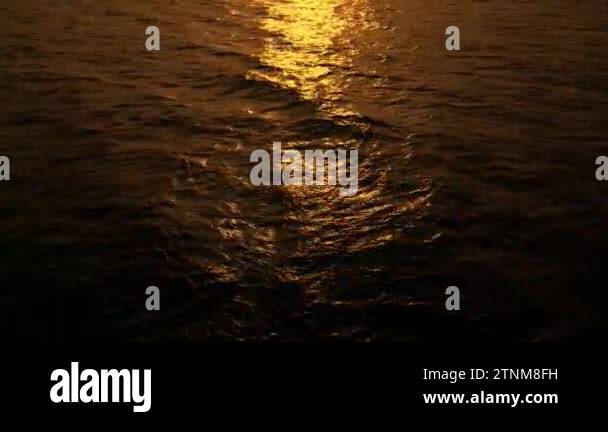 Sun reflecting on sparkling sea, ocean at sunset, Asia, Vietnam. Drone ...