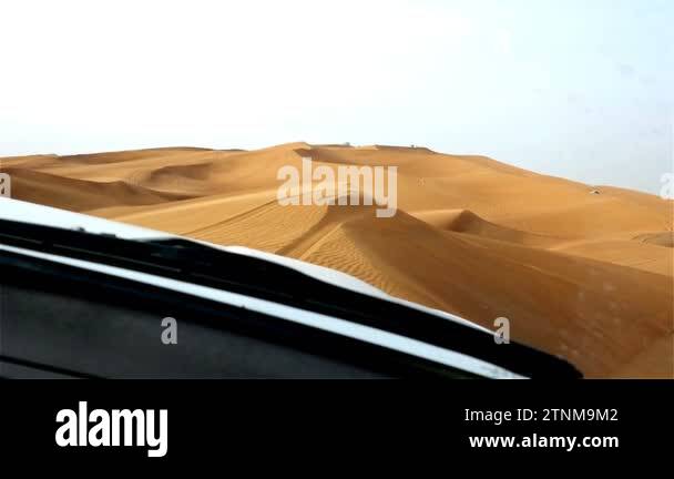 4x4 off road land vehicle taking tourists on desert dune bashing safari ...