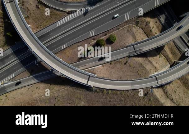 Aerial drone top down cinematic orbit of elevated highway junctions and ...