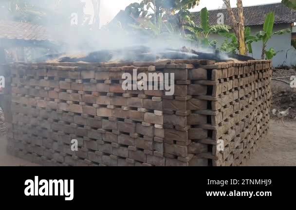 Red brick from clay. The process of making bricks in rural Indonesia ...
