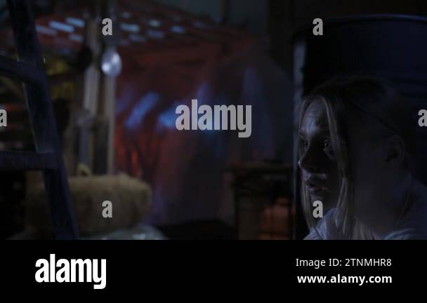 Horror movie scene. Closeup shot, focus on female face. Scared blonde ...