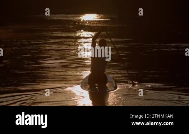 Sap board with a silhouette of a young man, rear view. An athlete is ...